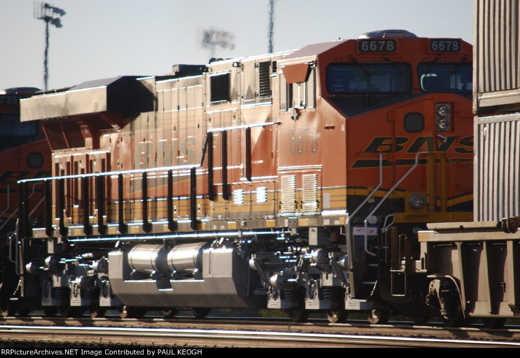 Off into the Rising Sun BNSF 6678 Highballs Eastbound with A Hot Z-Train as the sun's rays gleem ...